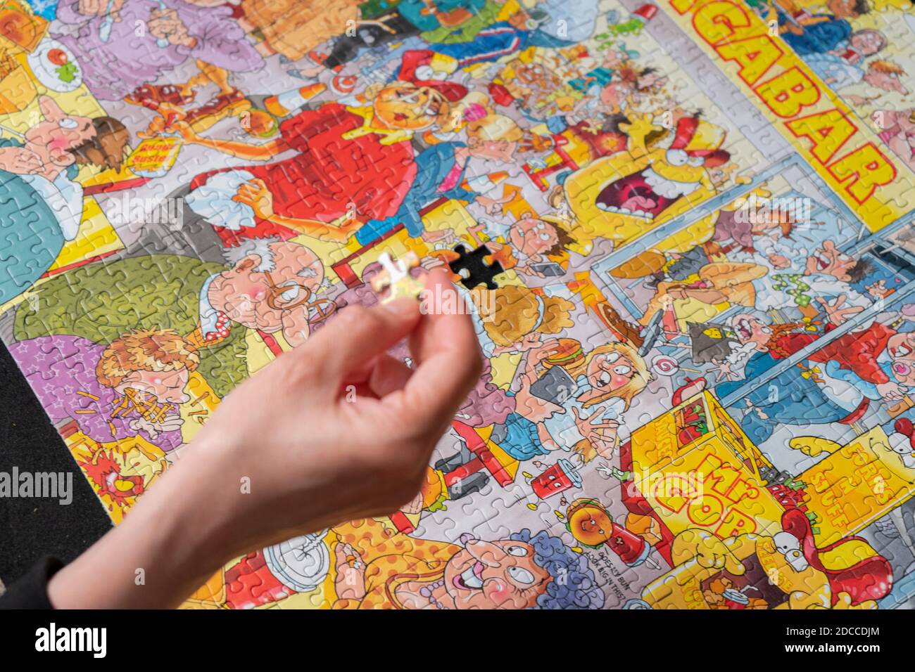 Completeing a jigsaw puzzle hi-res stock photography and images - Alamy