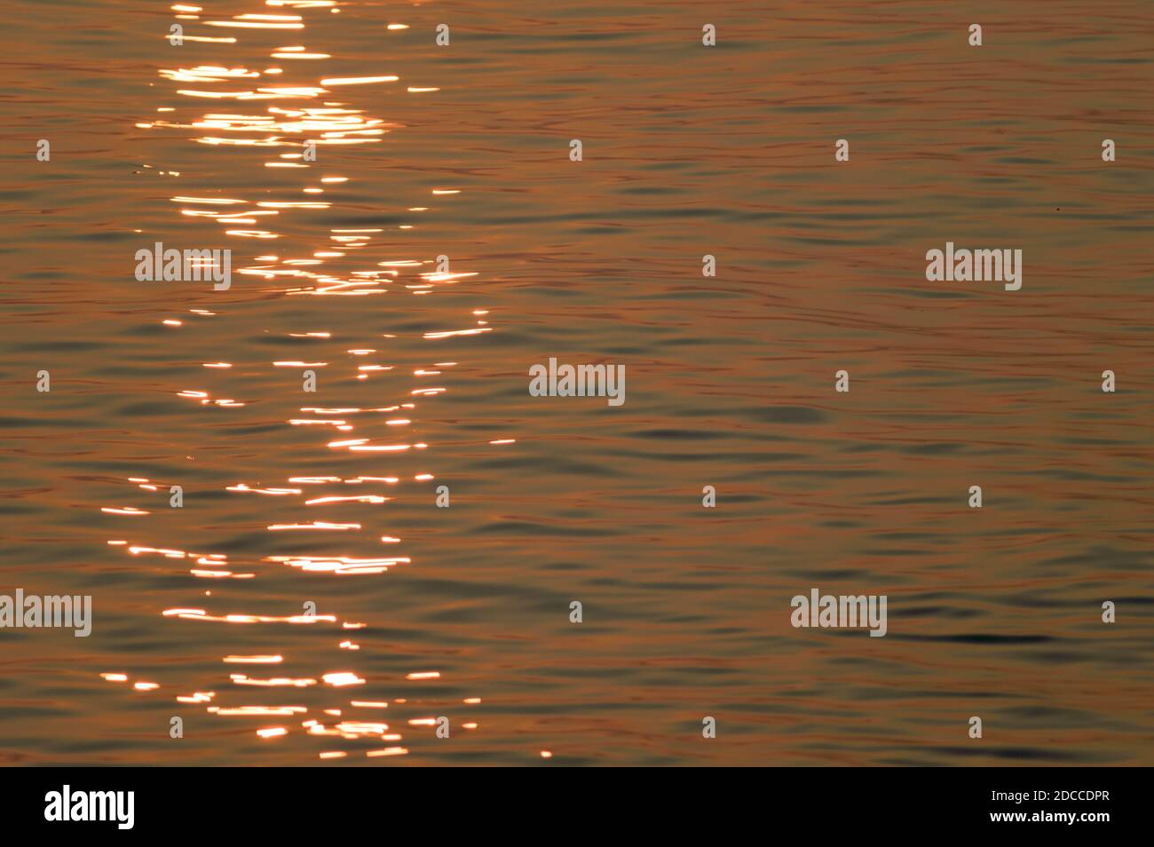 Sunset light reflection on the ocean Stock Photo - Alamy