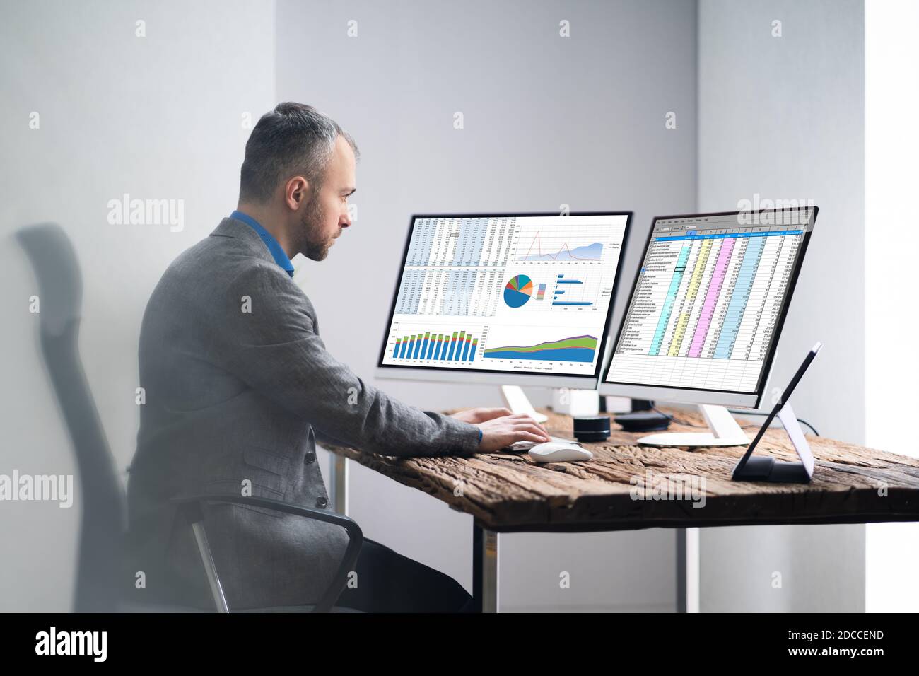 Analyst Employee Working With Spreadsheet On Computer Stock Photo - Alamy