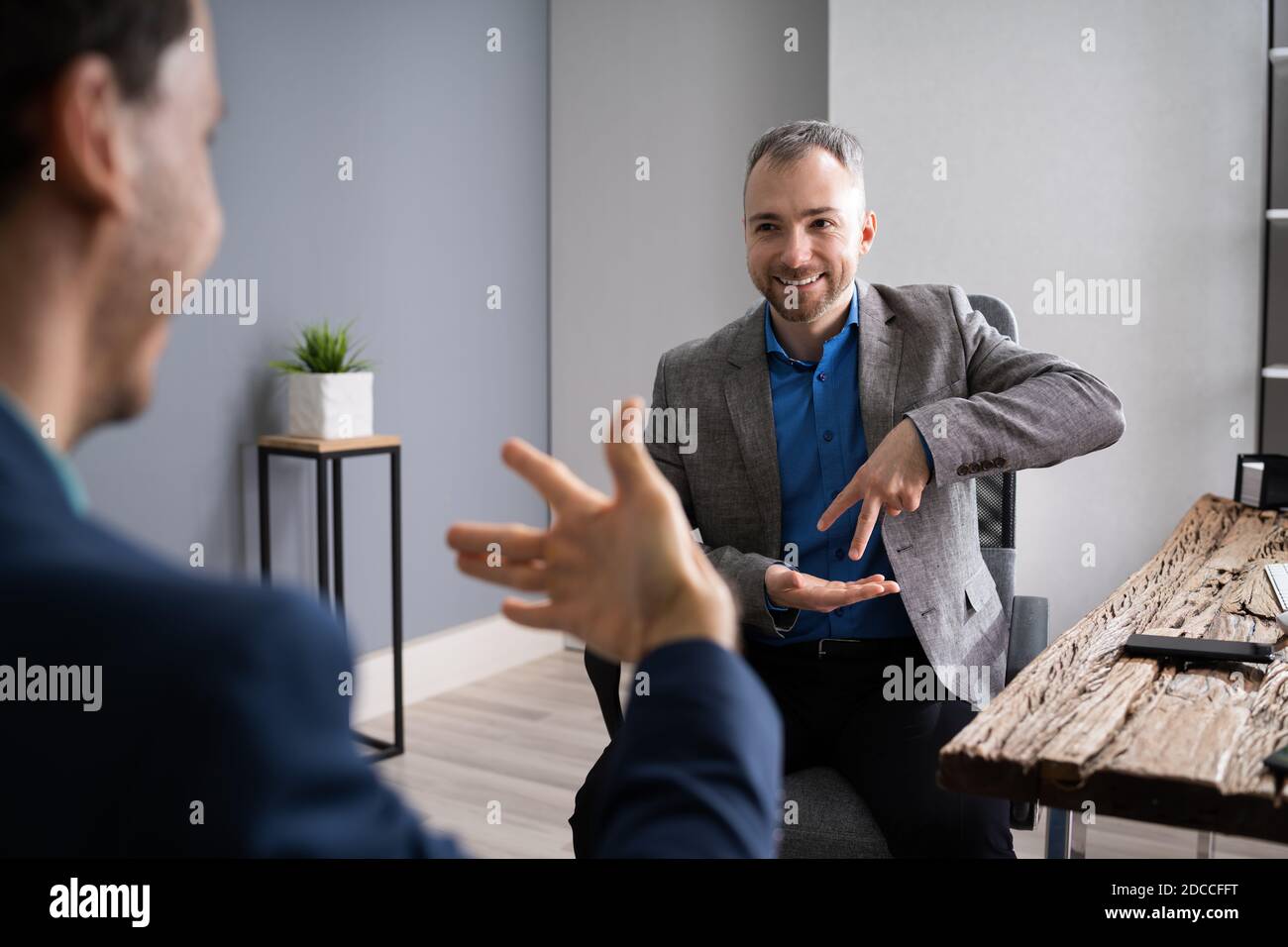 Learning Sign Language For Deaf And Disabled Stock Photo - Alamy
