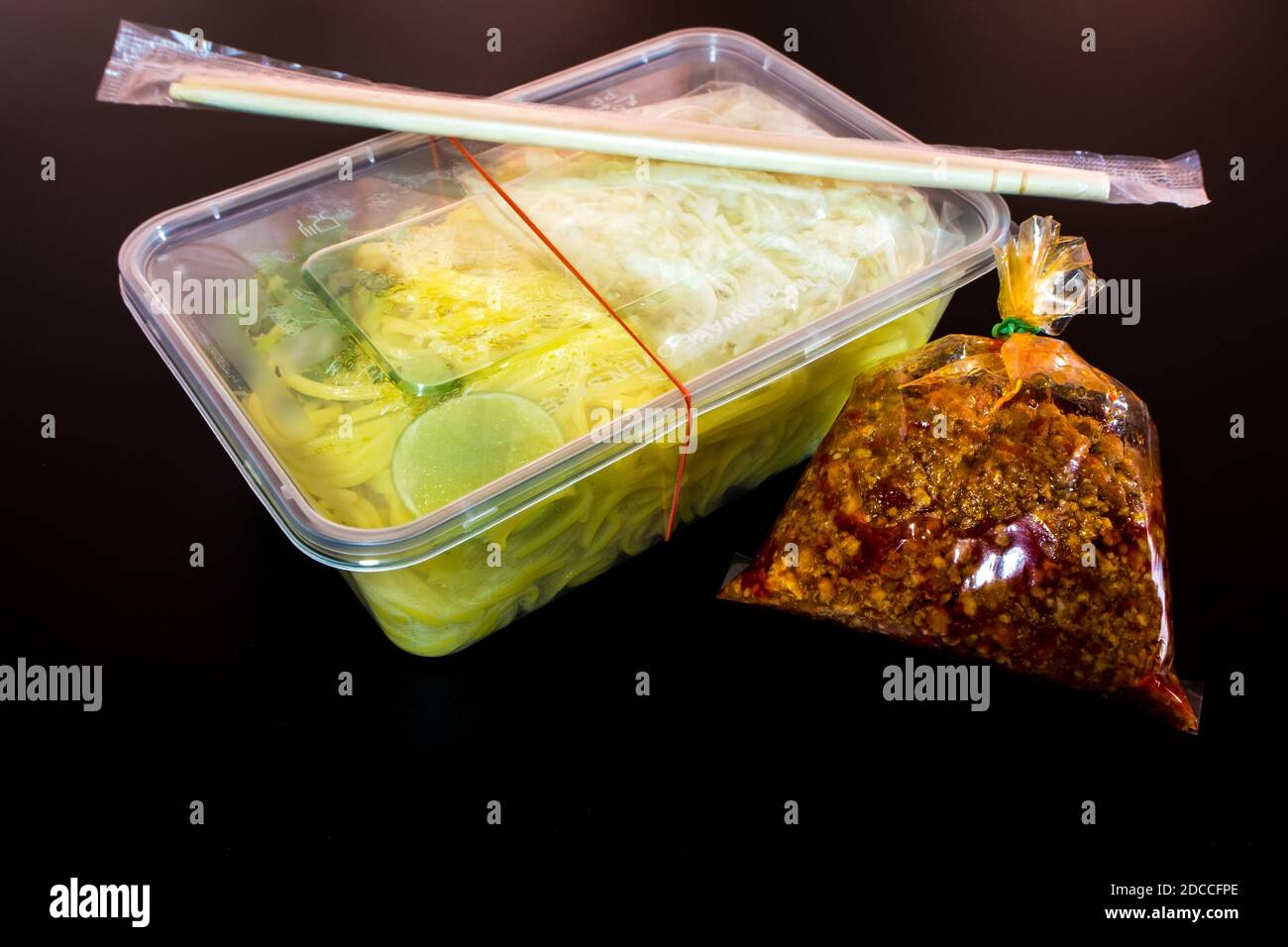 Spaghetti with sauce Take home food in plastic packaging Stock Photo ...