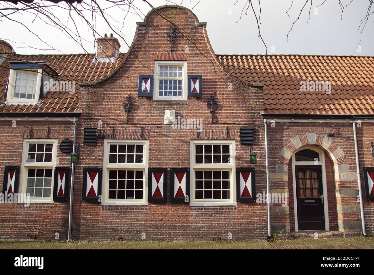 Old house, masonry, shuttered windows and bell gable of a 1787's Dutch ...
