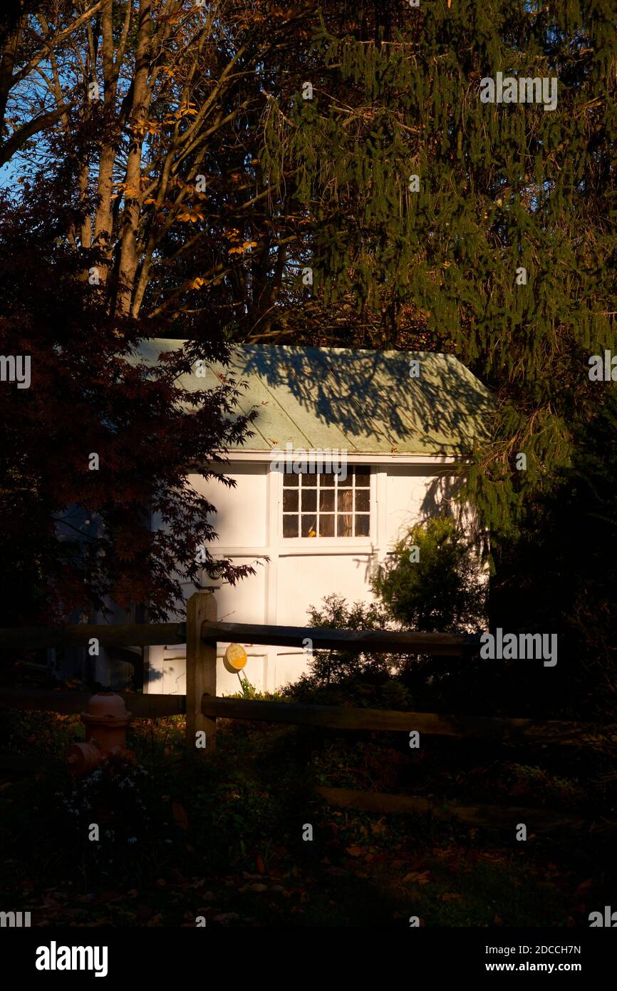 A small, wood shed at sunset in Dickeyville, the Colonial-era, historic ...