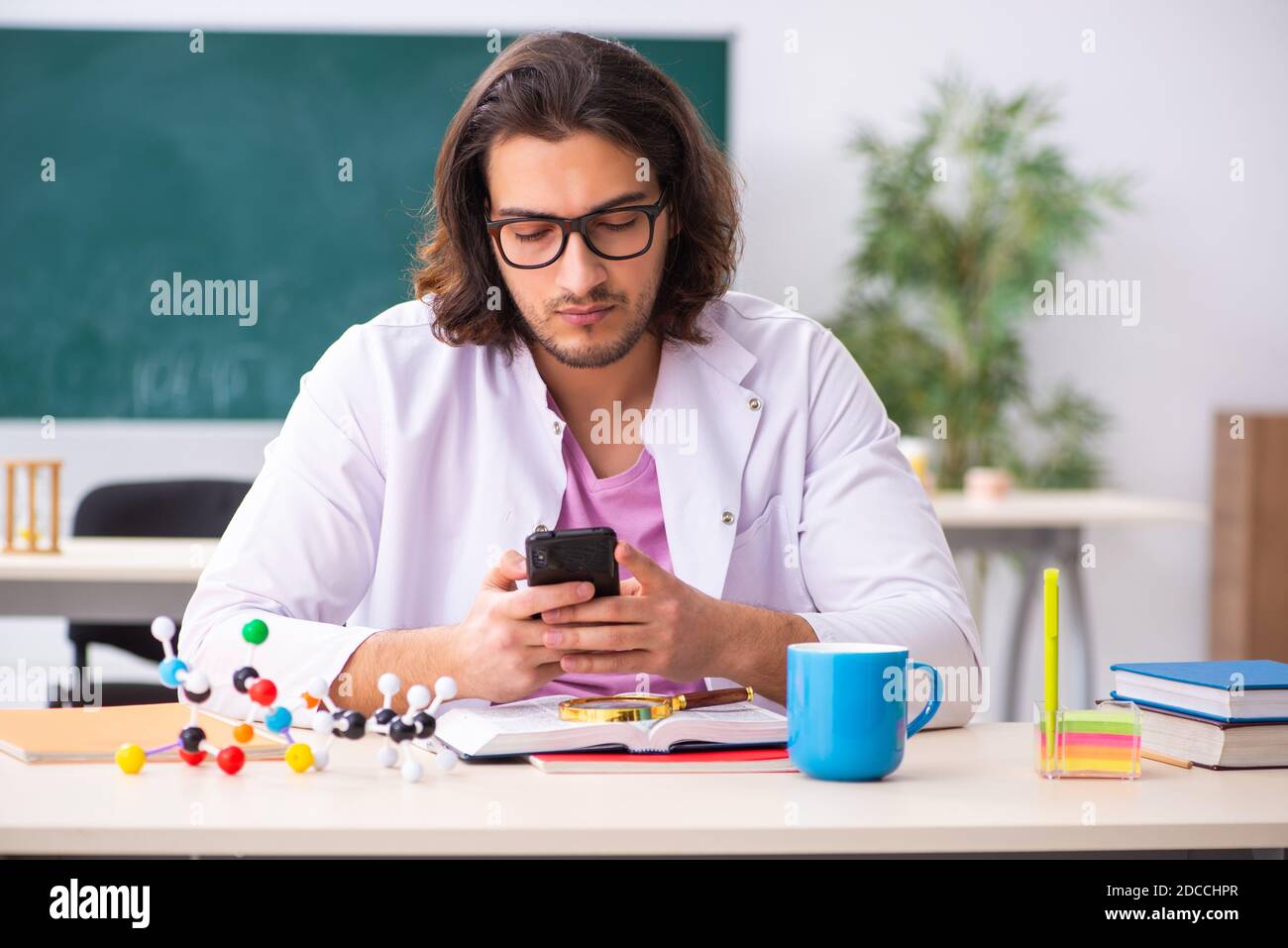 Young physicist in the classroom Stock Photo - Alamy
