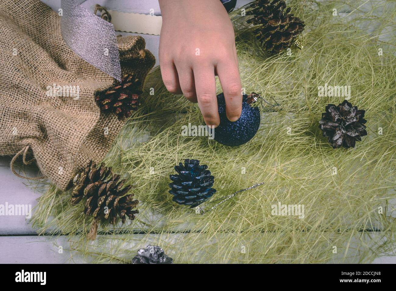 Child holds a handful of pine cones Stock Photo - Alamy