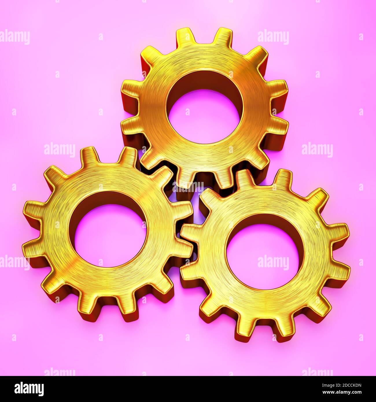 Three golden gear wheels on pink background Stock Photo - Alamy