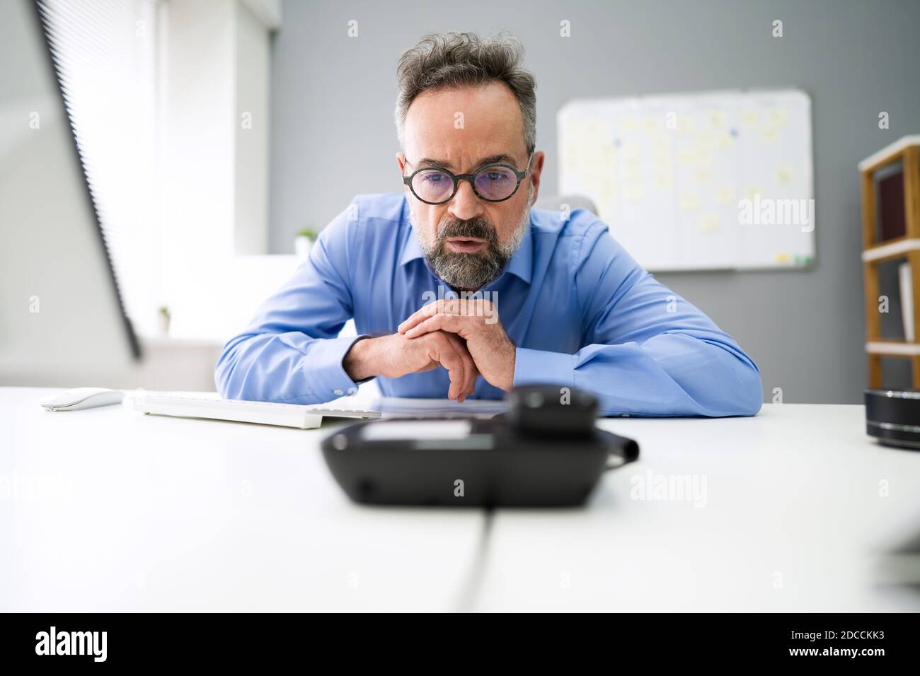 Waiting Landline Telephone Or Phone Call At Office Desk Stock Photo - Alamy