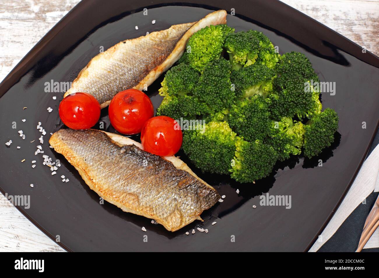 Grilled Fish Fillets With Broccoli Cherry Tomatoes Black Plate Stock ...