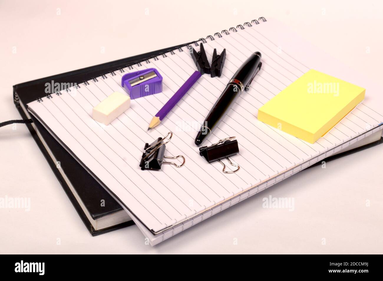 Office notepad, diary, pen and stationary isolated on white background ...