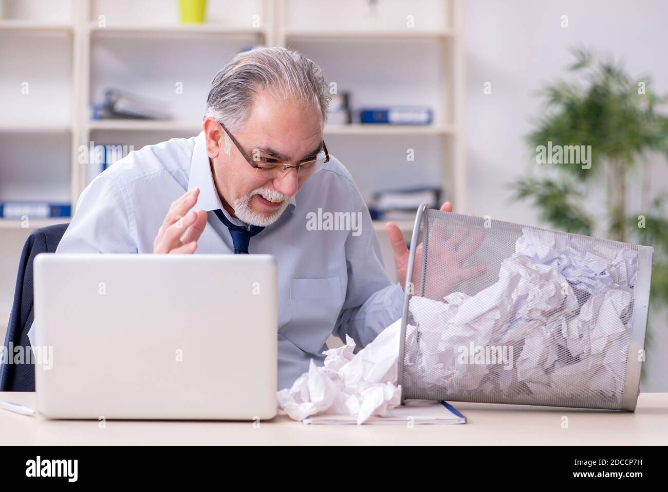 Old businessman rejecting ideas with lots of papers Stock Photo - Alamy