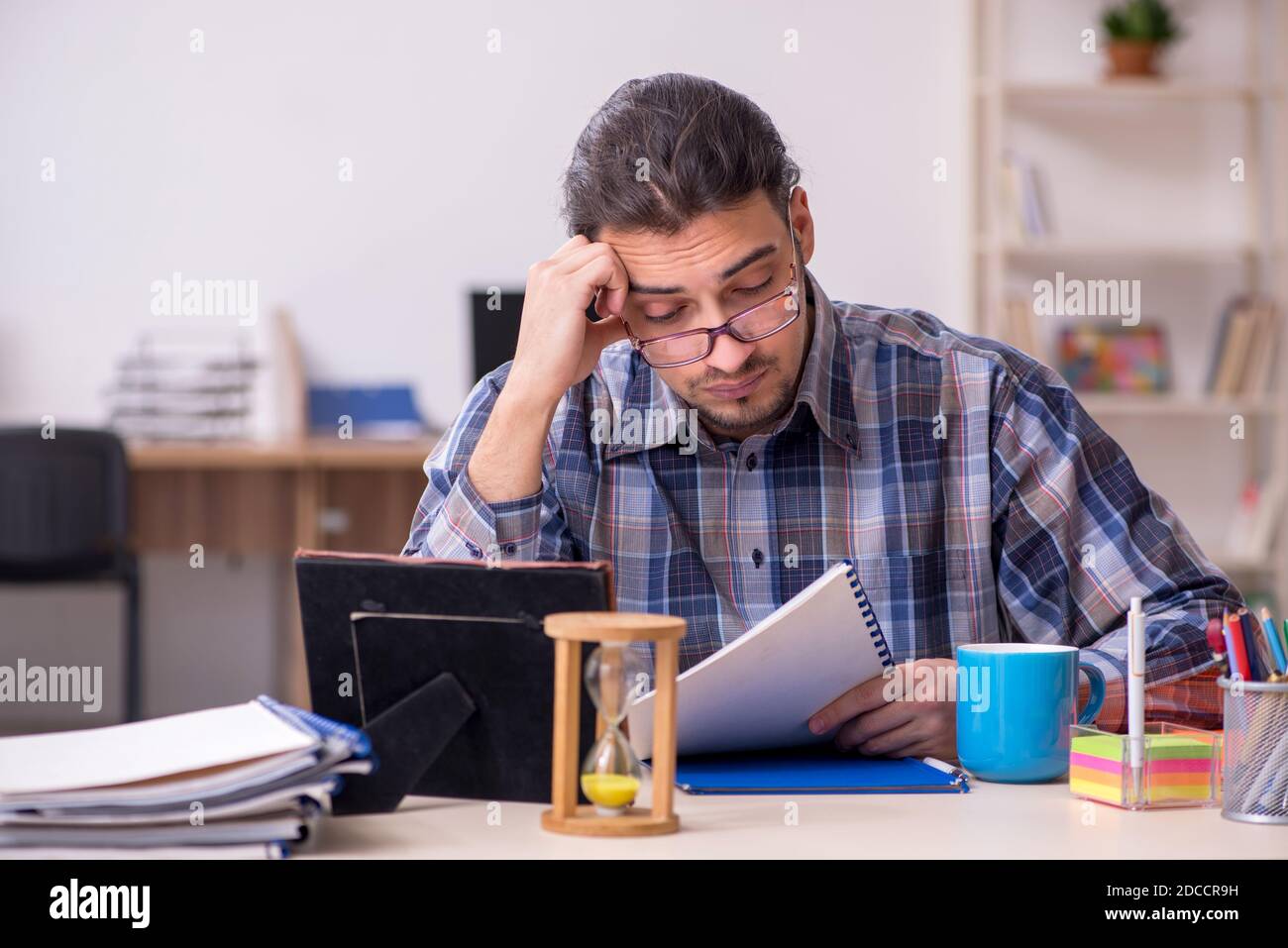 Young student sitting in the classroom Stock Photo - Alamy