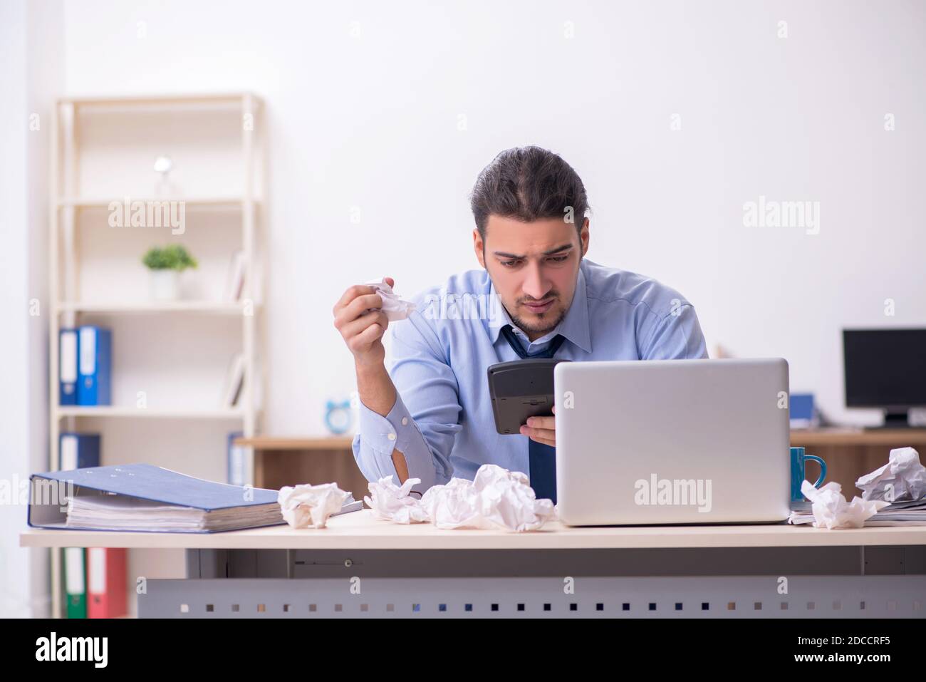 Sick male employee suffering at the workplace Stock Photo - Alamy
