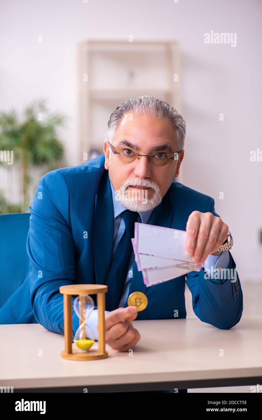 Man earning money via Internet in time management concept Stock Photo ...