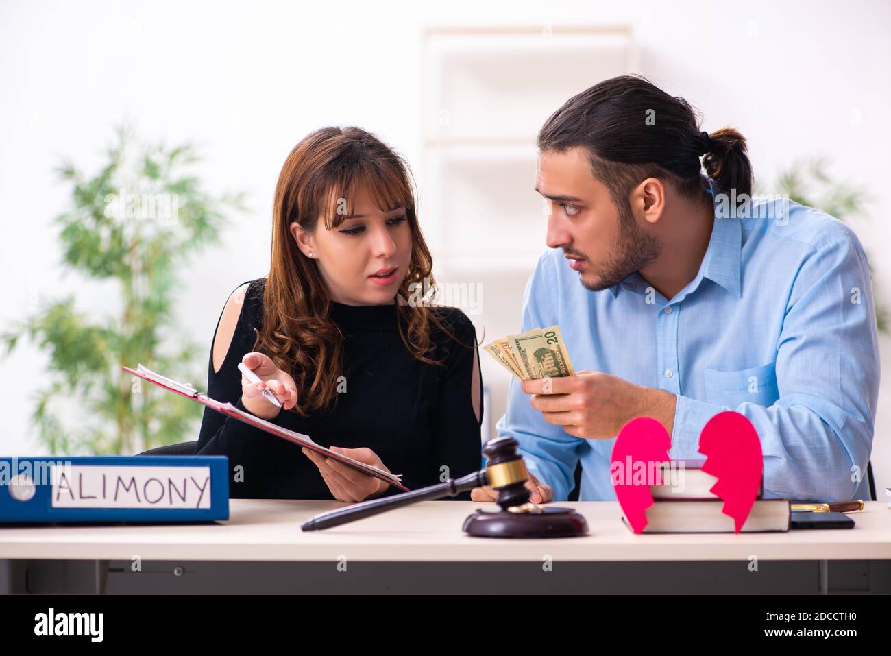 Couple divorcing in alimony concept Stock Photo - Alamy