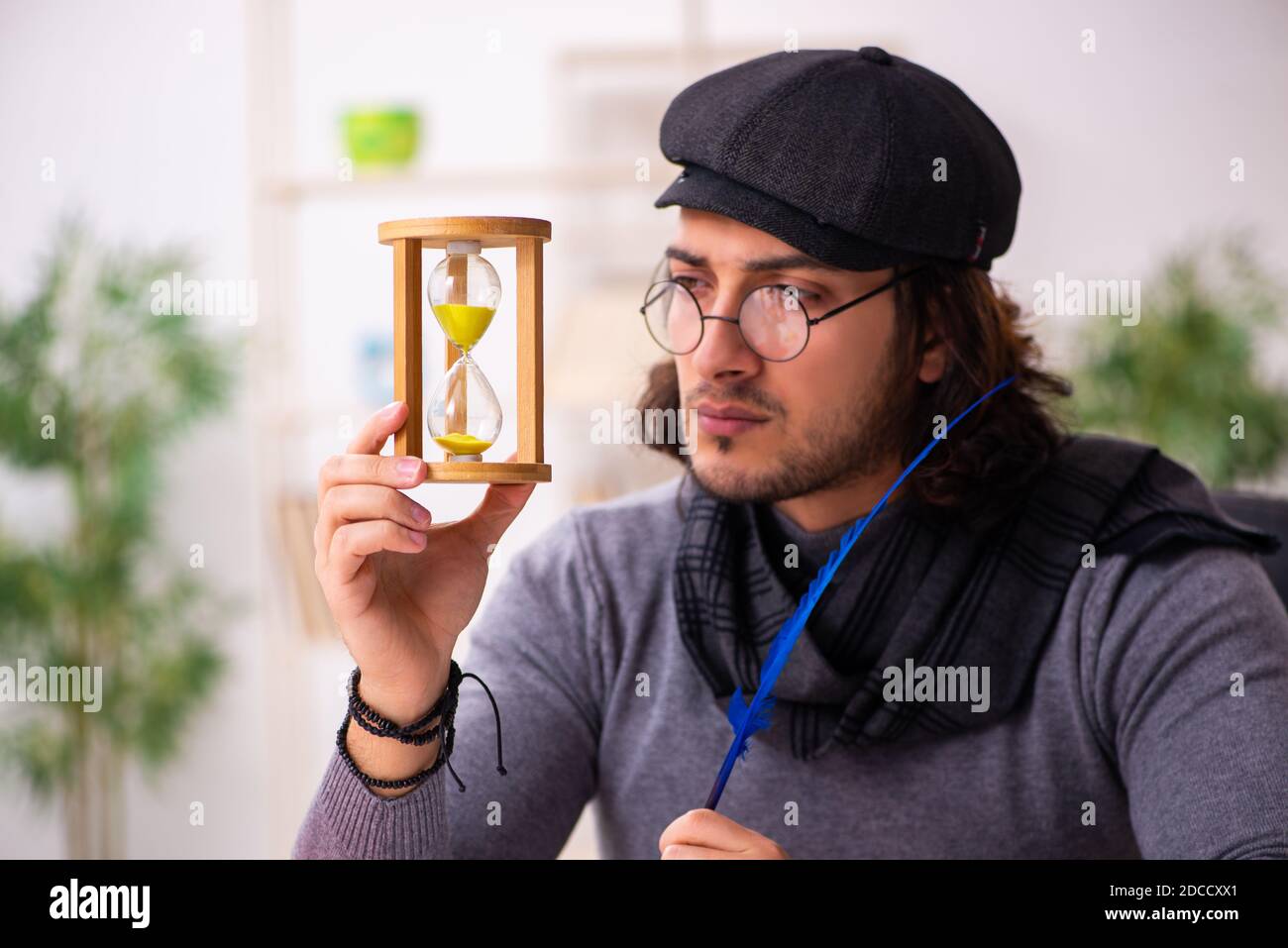 Male writer in time management concept Stock Photo - Alamy