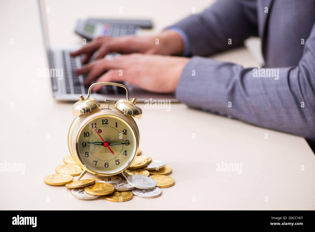 Man earning money via Internet in time management concept Stock Photo ...