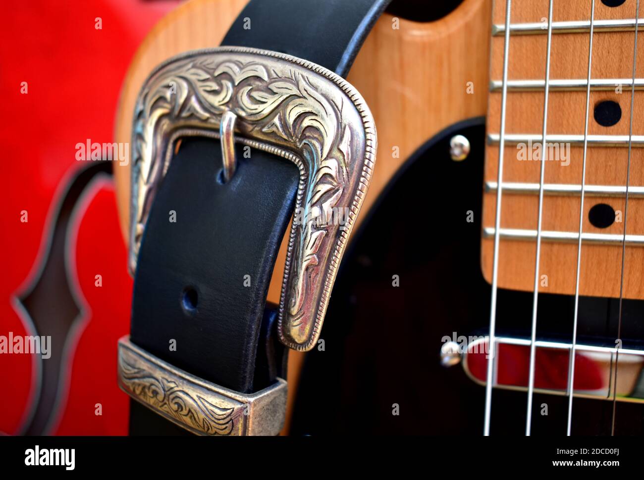 Electric guitars and leather strap with silver buckle close-up Stock ...