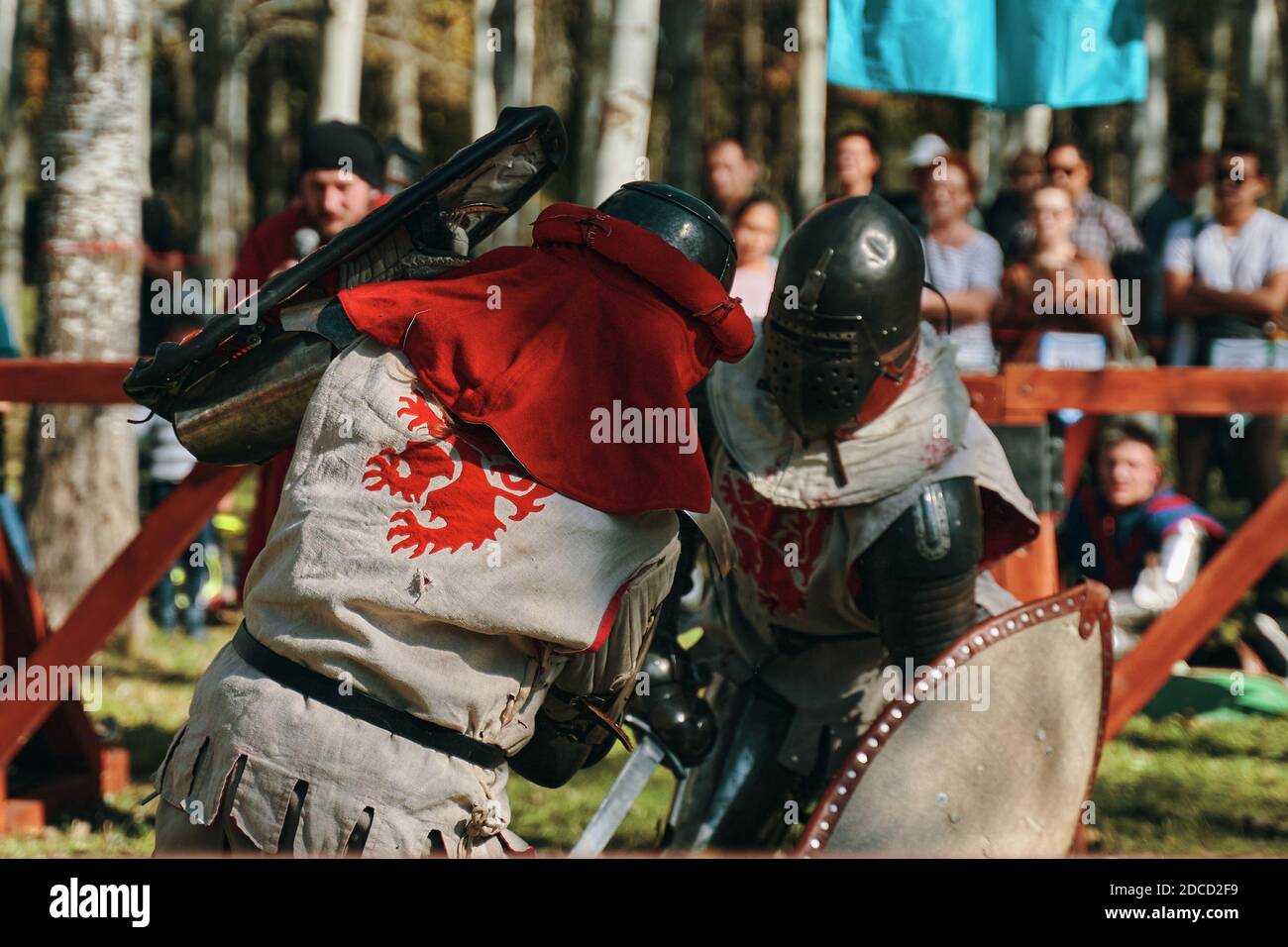 Imitation of medieval jousting. The battle of two knights with swords ...