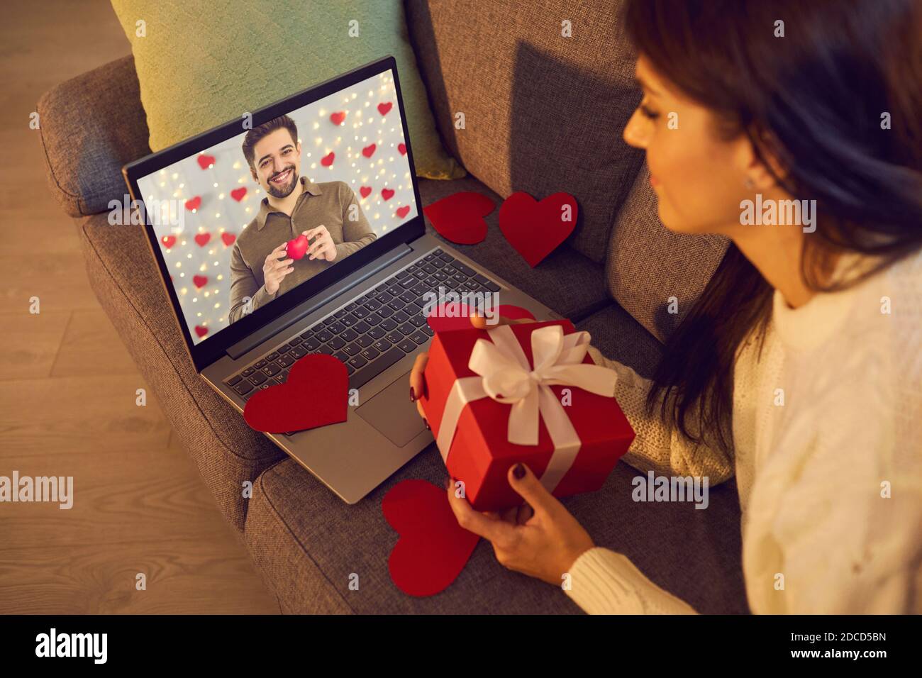 Happy young man and woman sending each other love on virtual date on ...