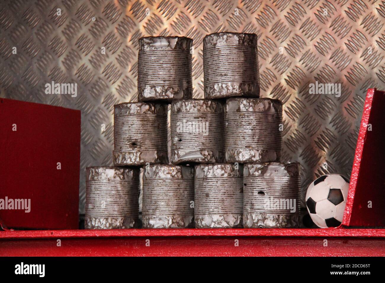 The Cans and Ball of a Throwing Prize Fun Fair Game Stock Photo - Alamy