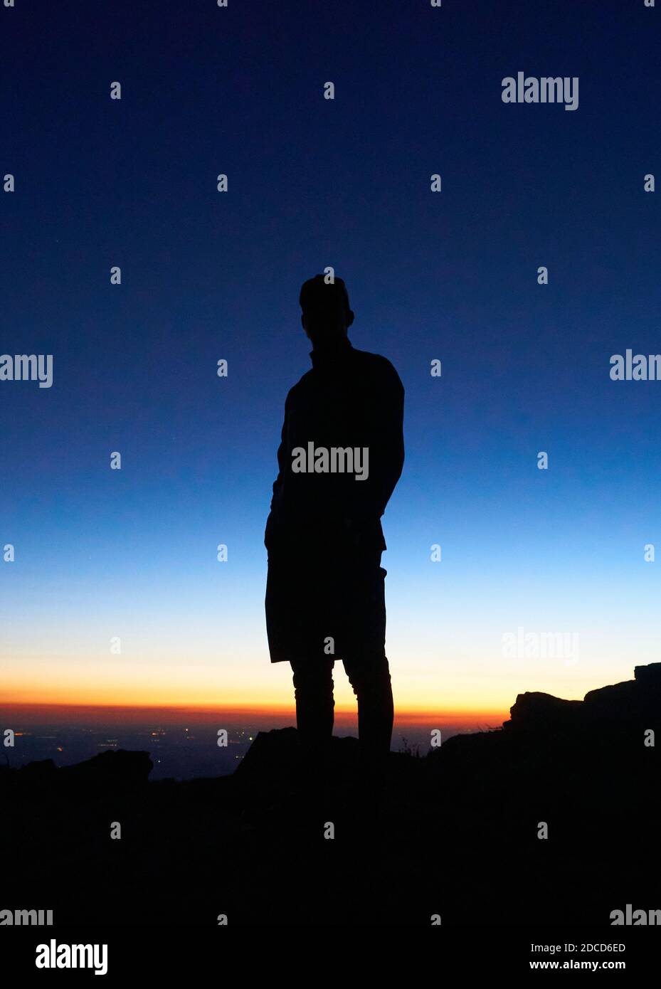silhouette of a man with sunset behind Stock Photo - Alamy