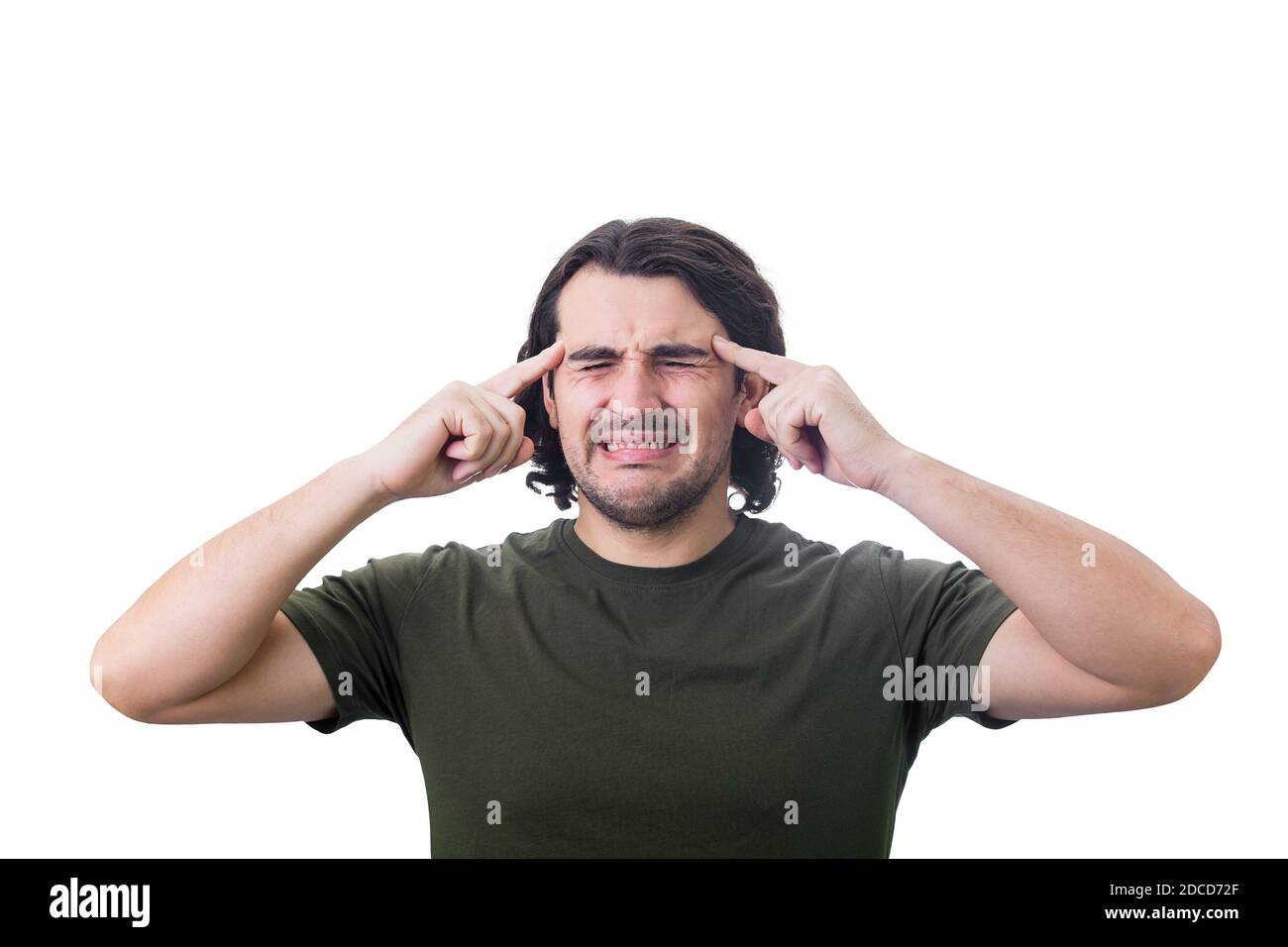 Young man, keeps fingers to his temples, clenching teeth as feels head ...