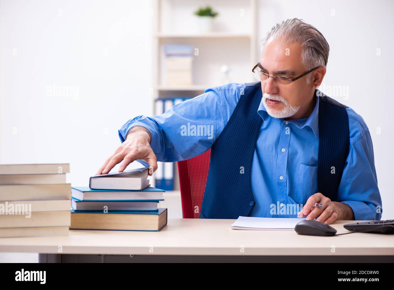 Old male author writing books at home Stock Photo - Alamy