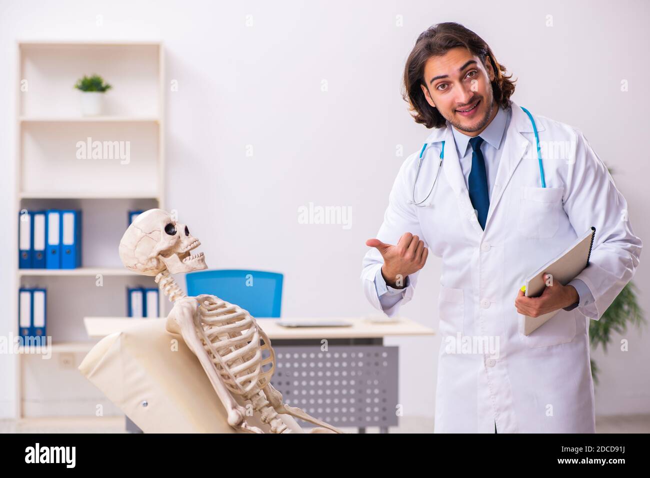 Crazy doctor examining the dead patient Stock Photo - Alamy