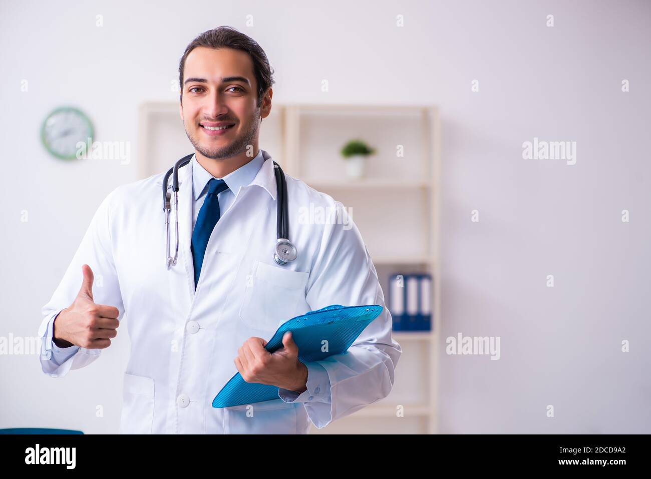 Handsome doctor giving thumb up hi-res stock photography and images - Alamy
