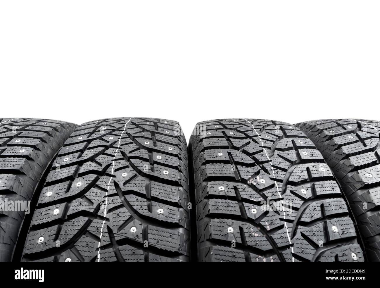 Winter studded tire. Winter car tires isolated on white background ...