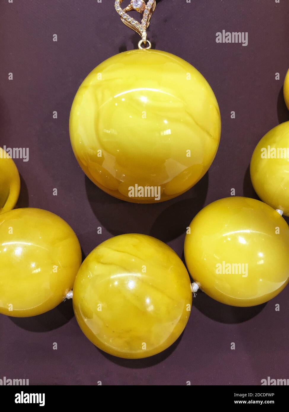 yellow round amber balls from the Baltic Sea. White Royal amber Stock ...