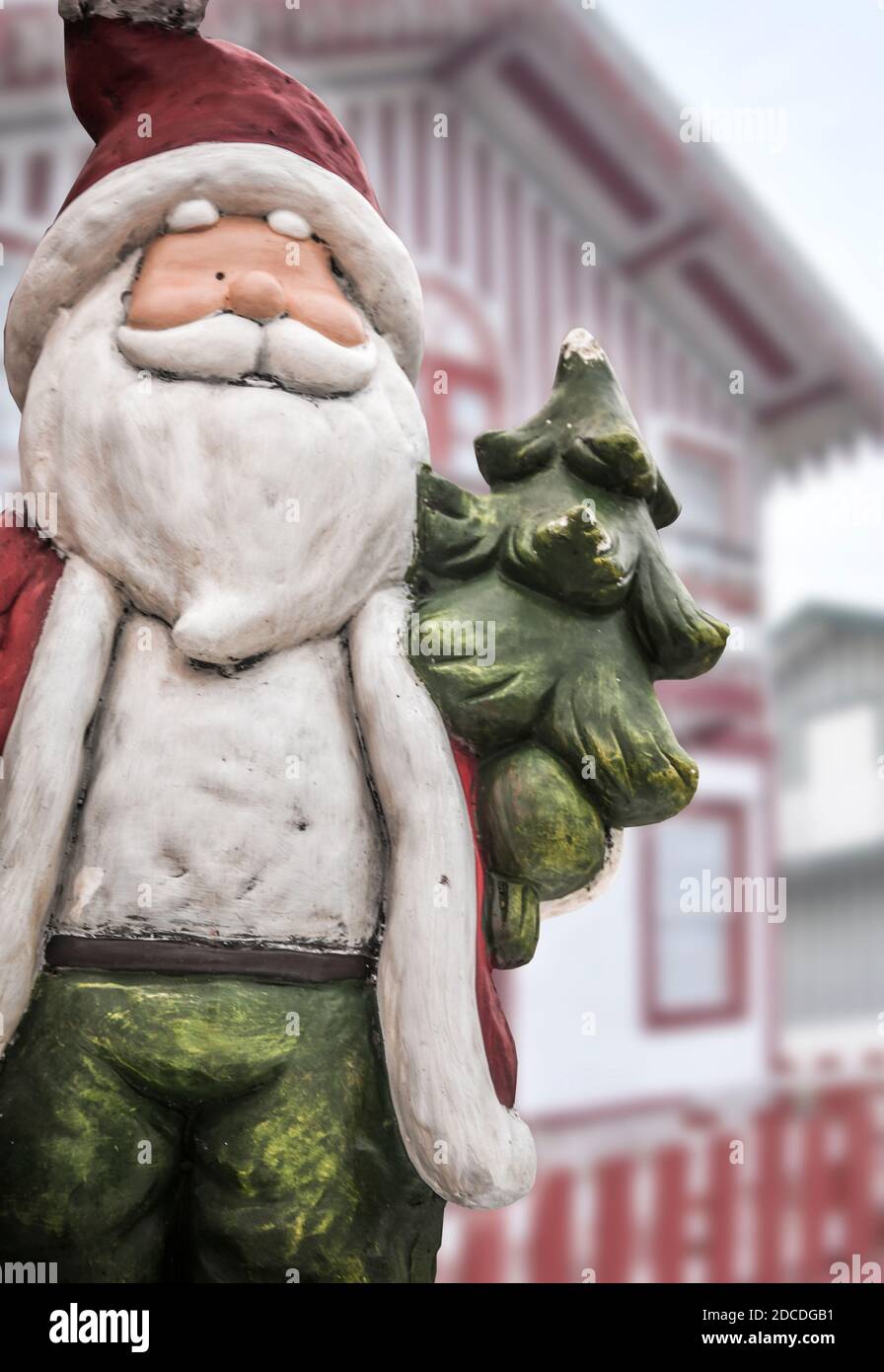 Funny Santa Claus in christmas scene with colorful houses Stock Photo ...