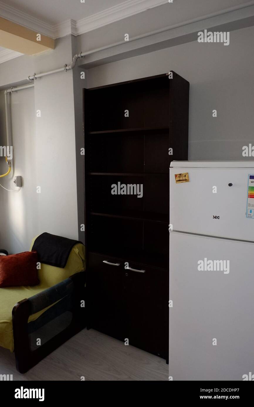 Regular room with Refrigerator and Armchair Stock Photo - Alamy