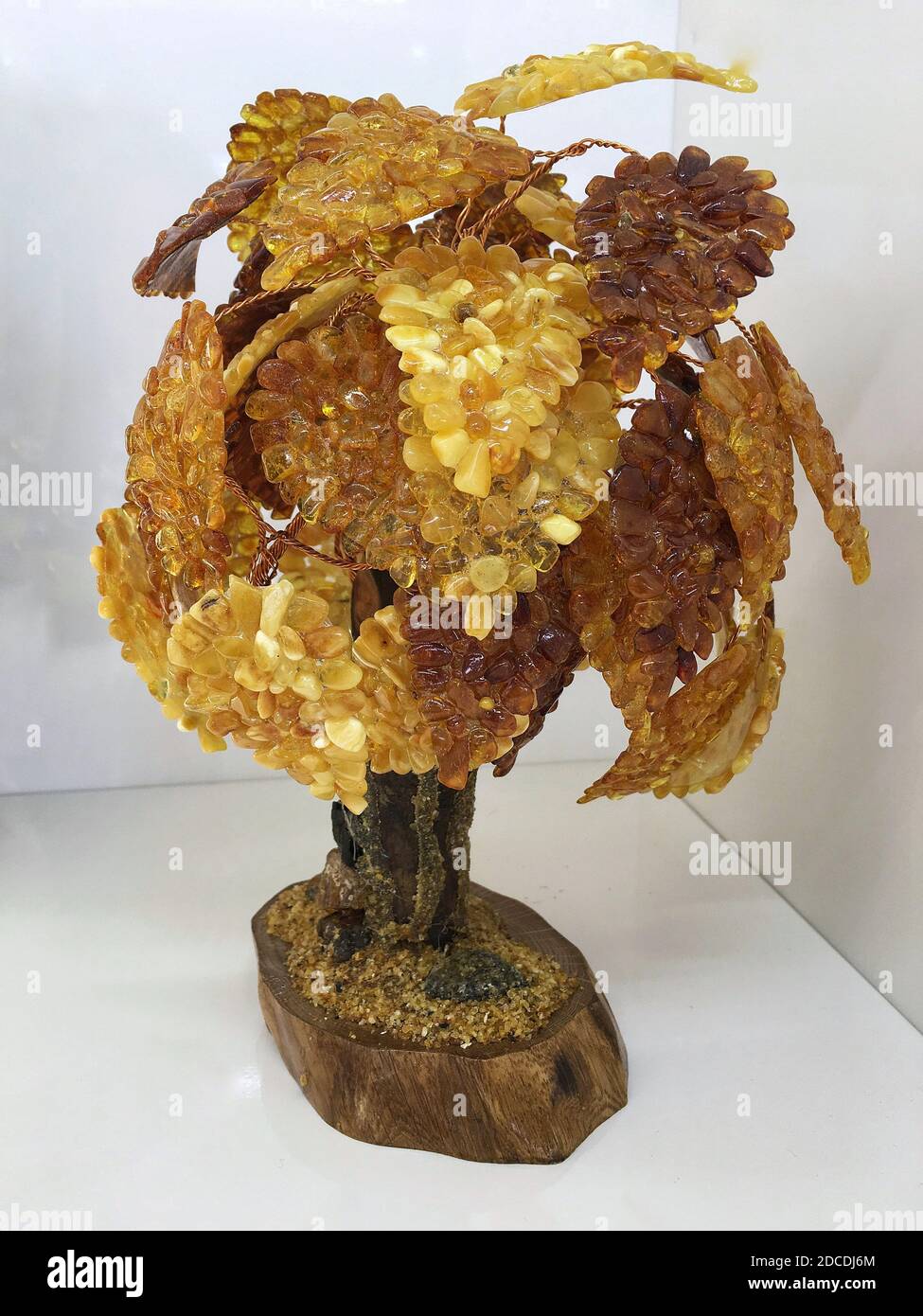 Handmade souvenir tree made of many small pieces of natural Baltic ...