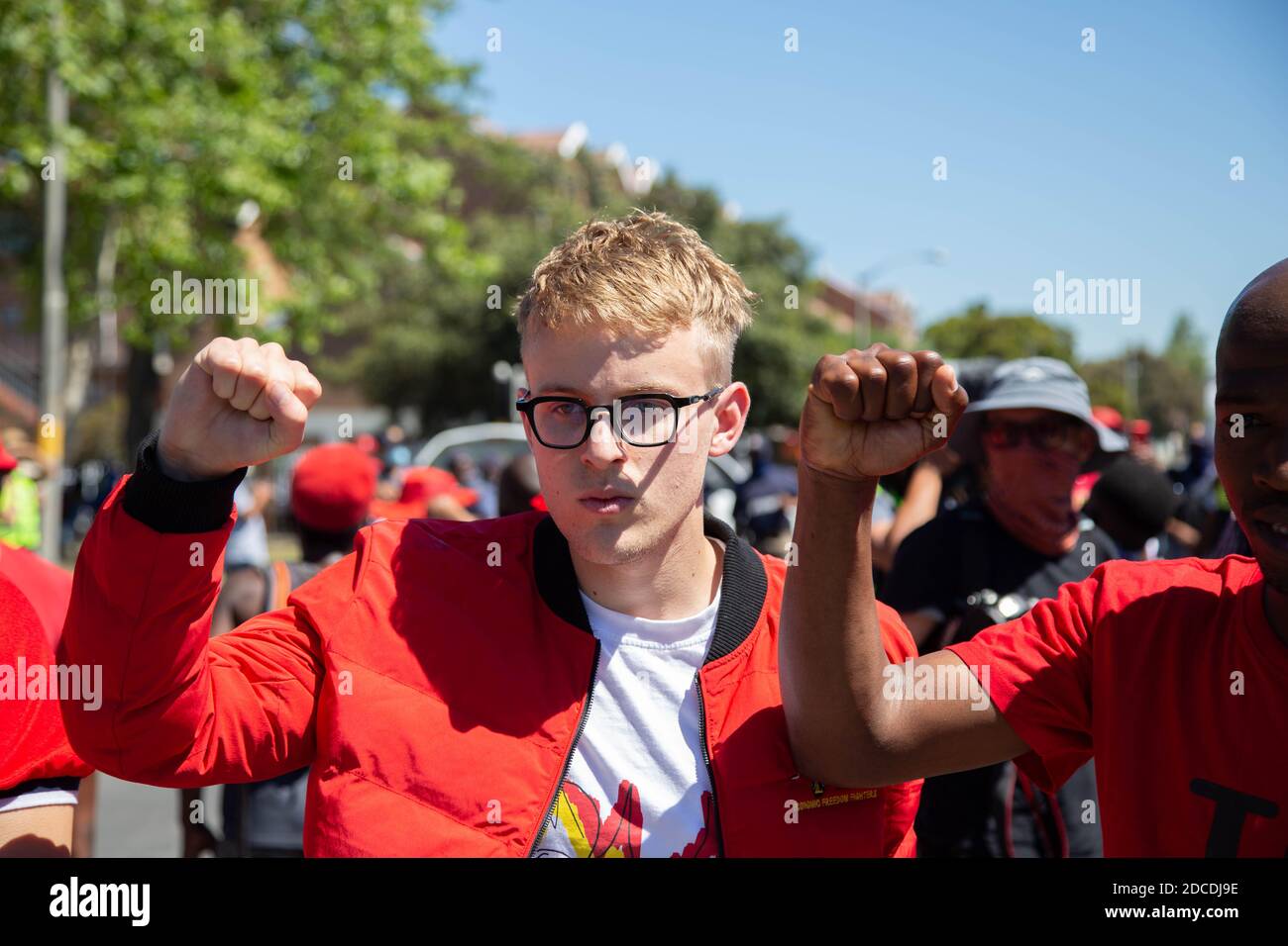 Part of the protesters, Jack Markovitz raises his fist during the ...