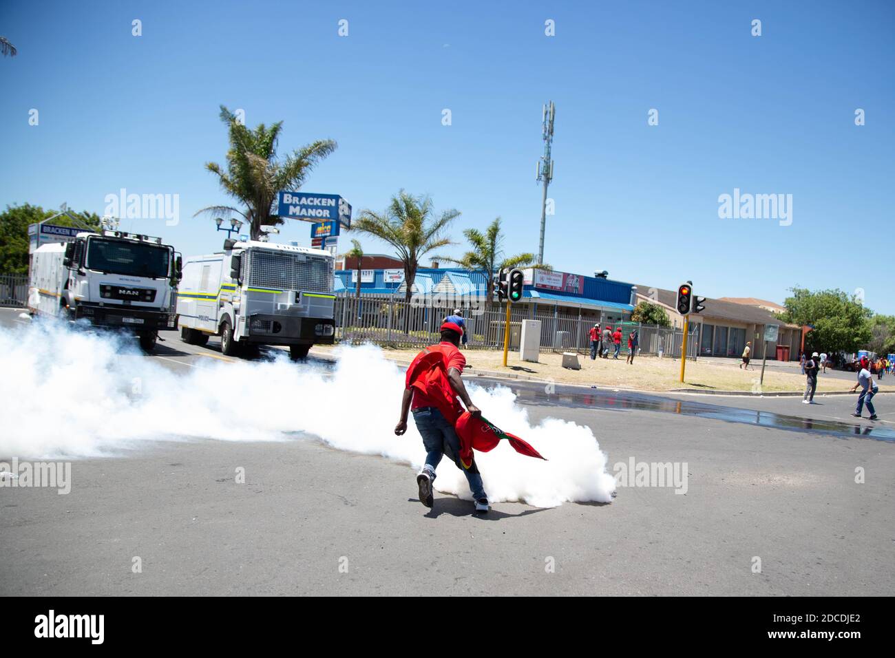 Police vehicles firing teargas at protesters during the demonstration ...