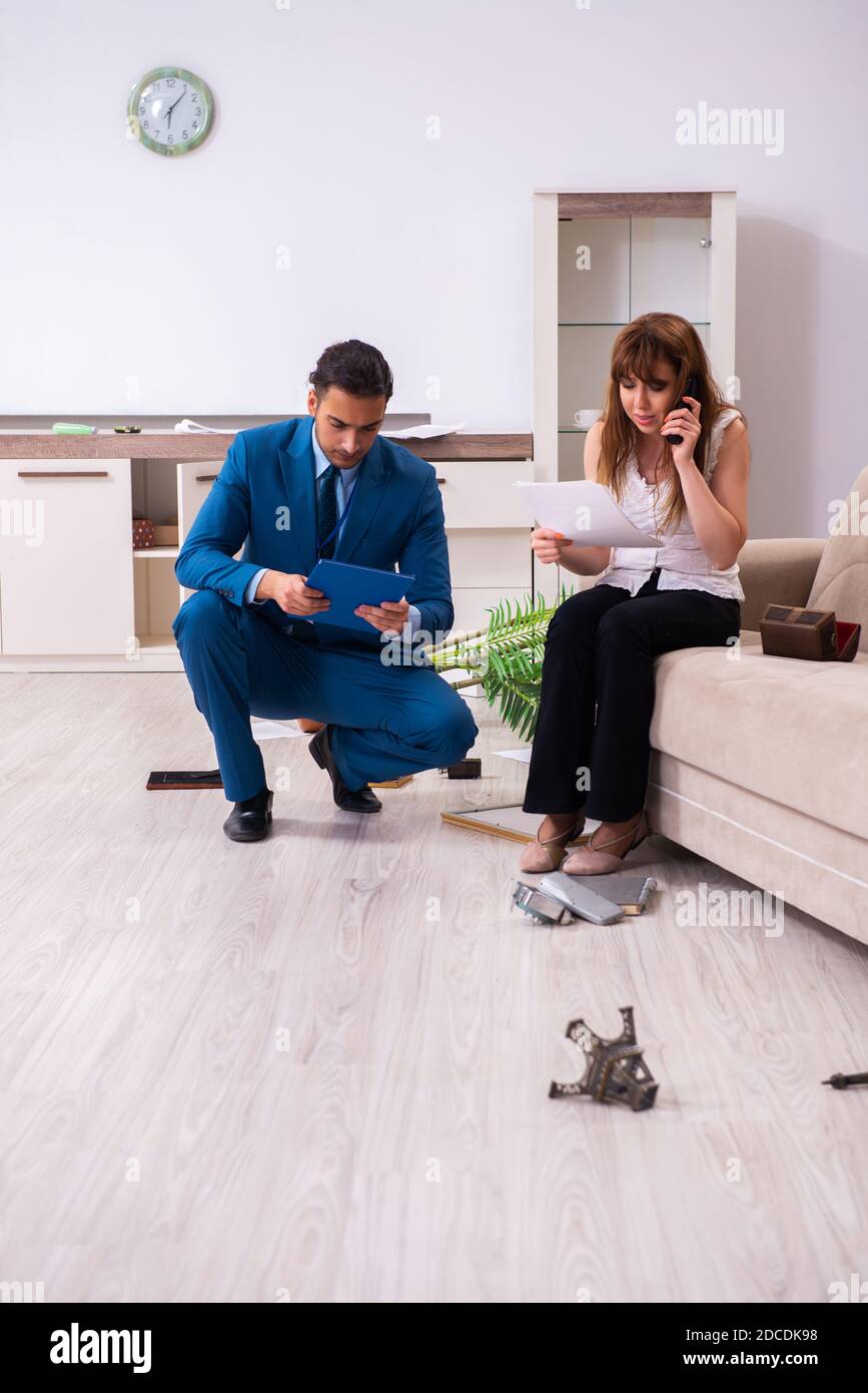 Female owner and police officer in housebreaking concept Stock Photo ...