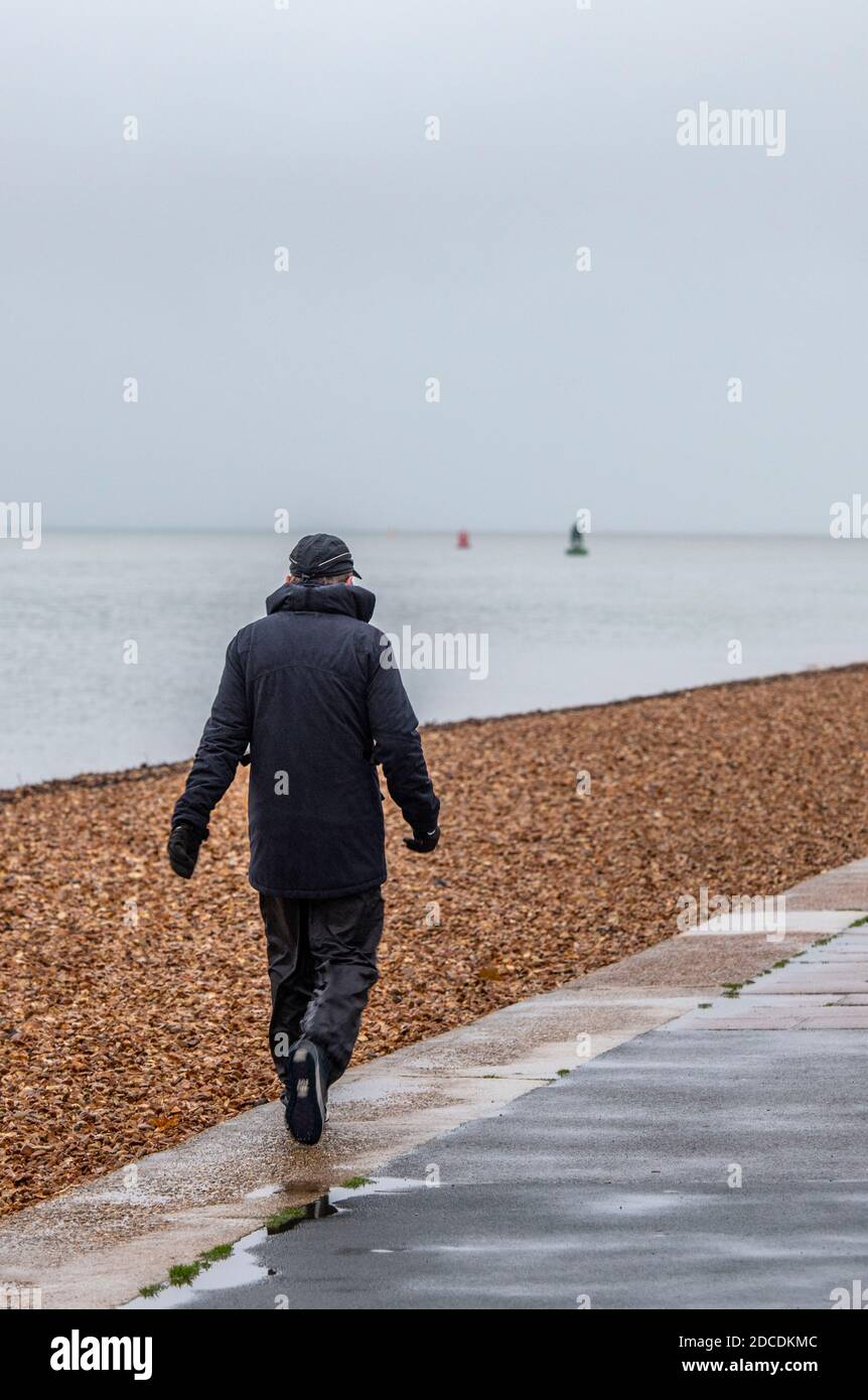 Man Walking In The Rain