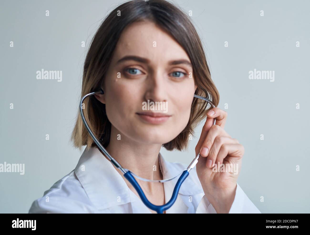Blue stethoscope woman doctor professional worker portrait cropped view ...