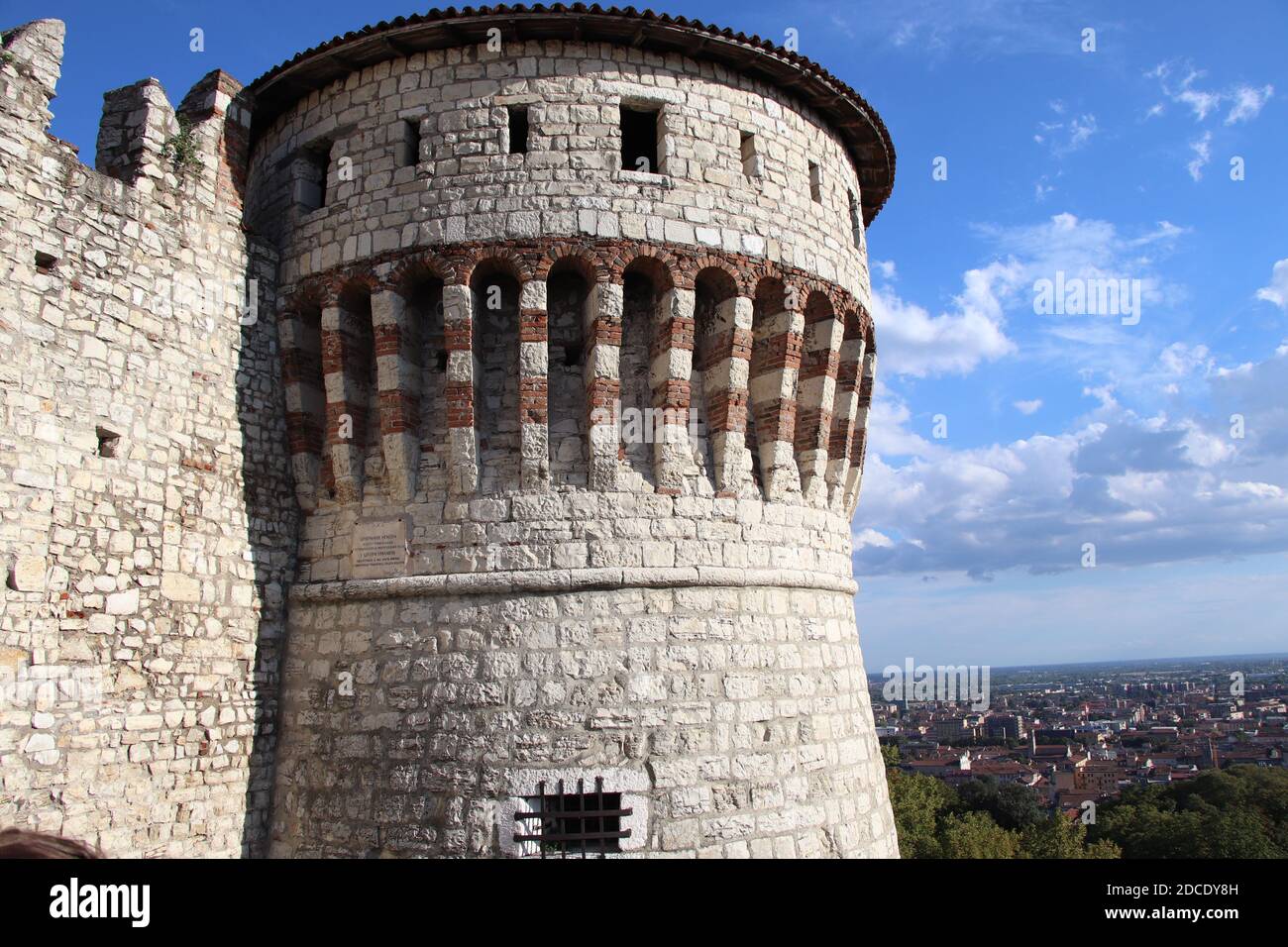 Stone wall with merlons and drawbridge gate of medieval castle of ...
