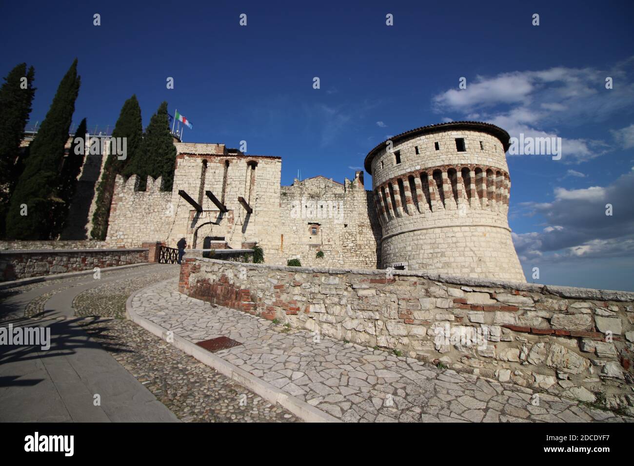 Stone wall with merlons and drawbridge gate of medieval castle of ...