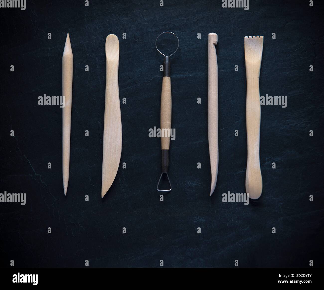 group of pottery tools for clay crafting flat lay knolling design shot ...