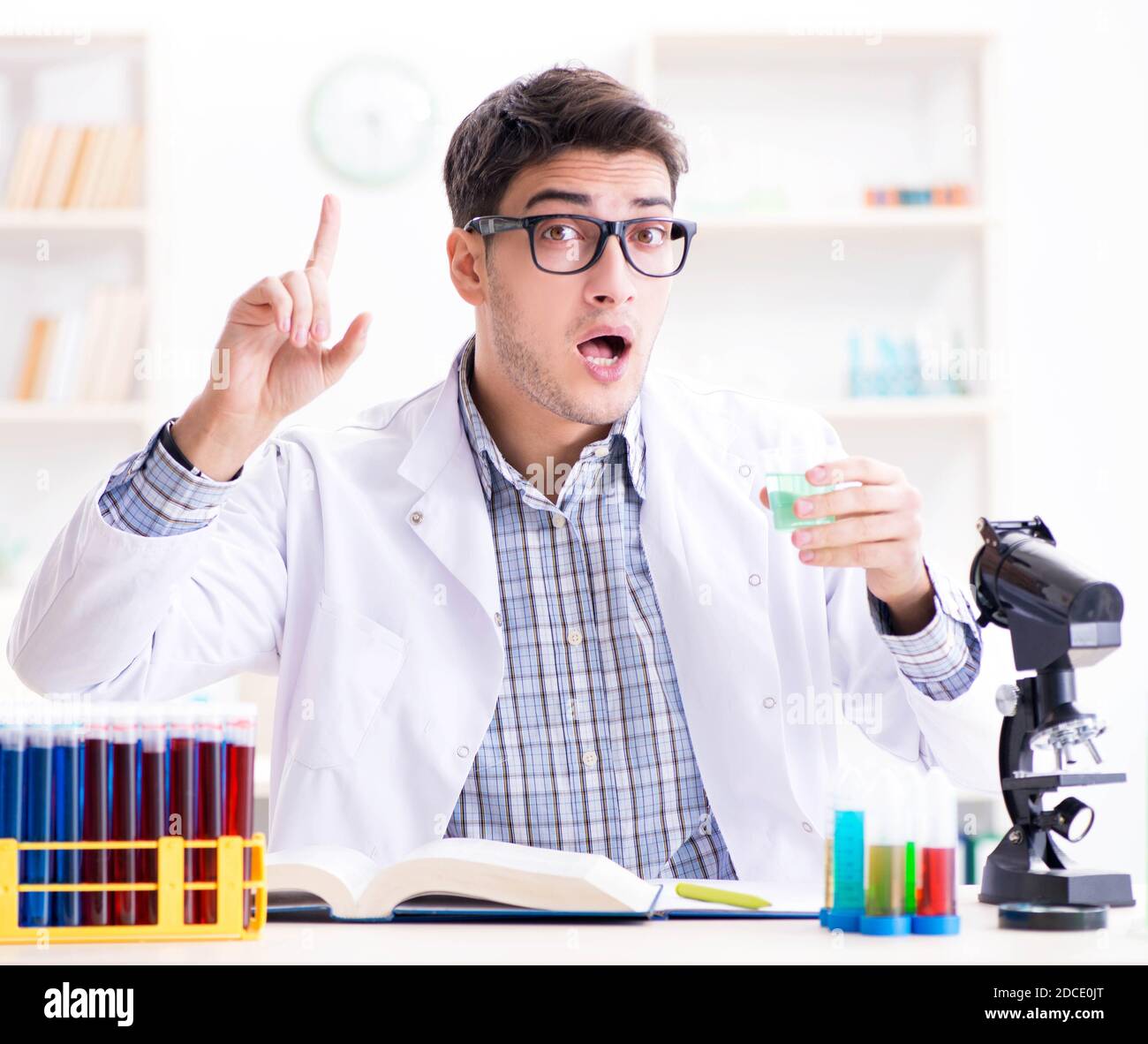 Chemistry student doing chemical experiments at classroom activity ...
