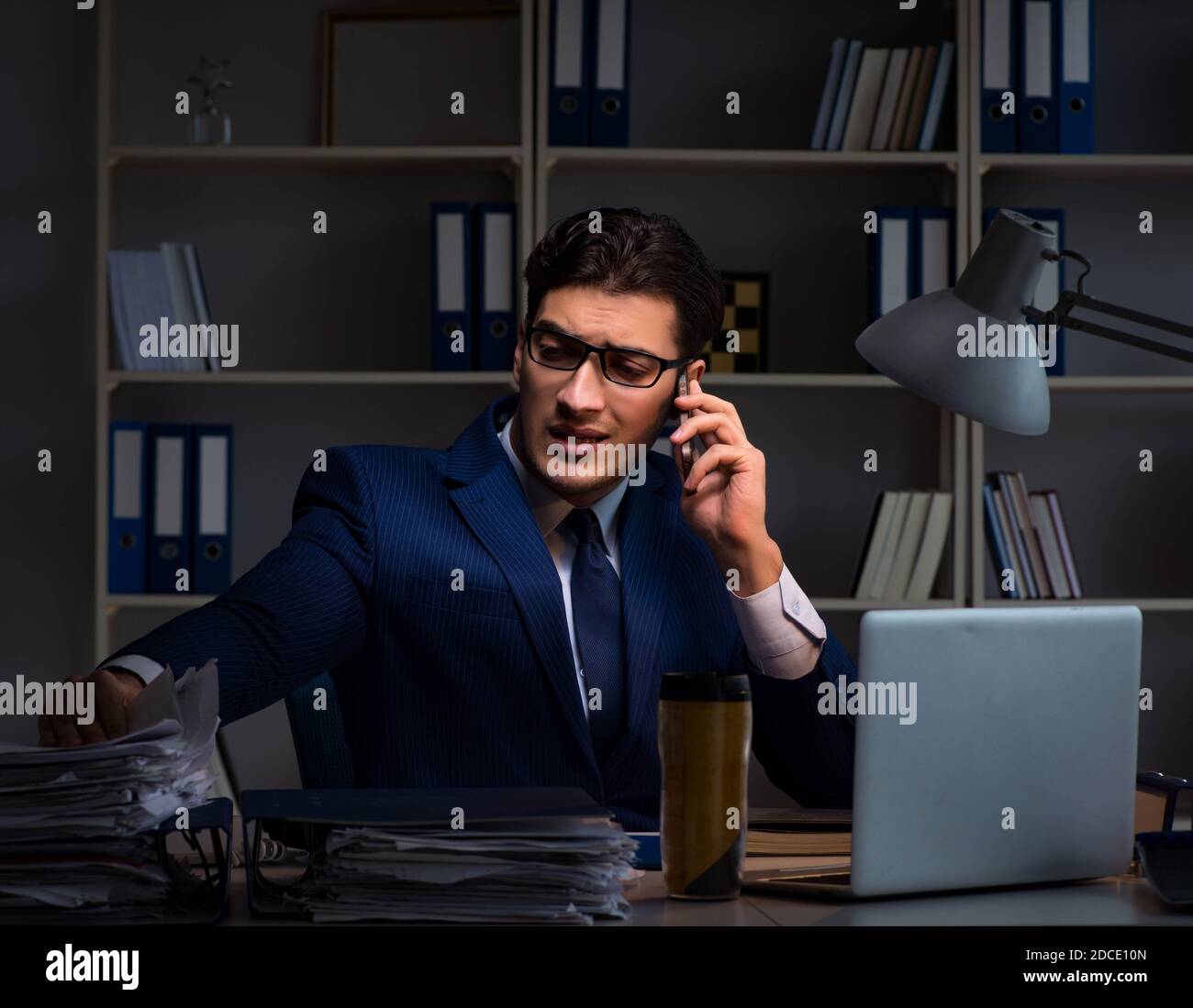 The employee working late to finish important deliverable task Stock ...