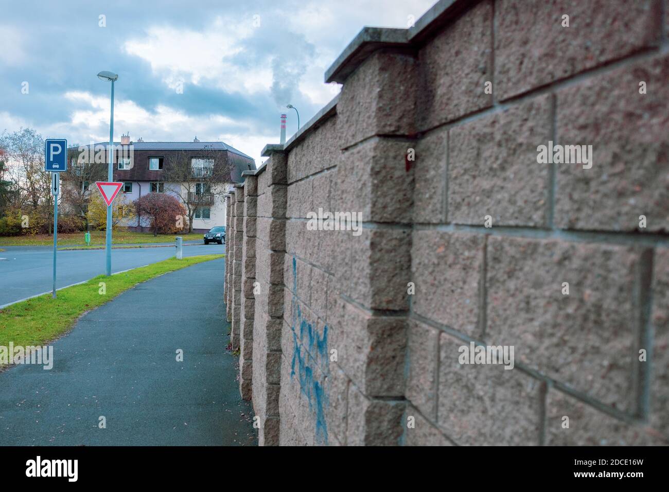 Chimney towering in the distance above the fence Stock Photo - Alamy