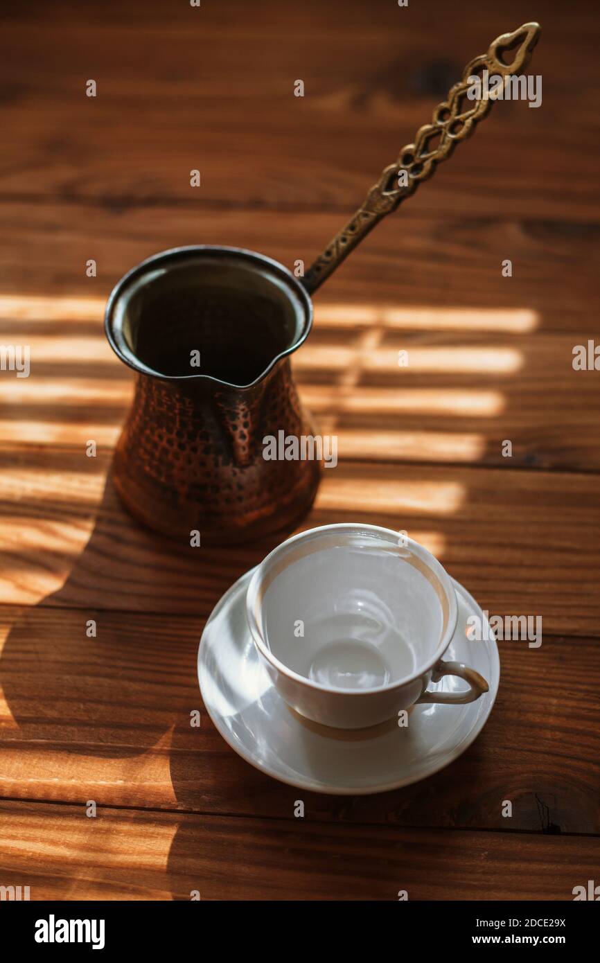 Traditional copper turkish coffee pot, cezve, ibrik and empty white ...