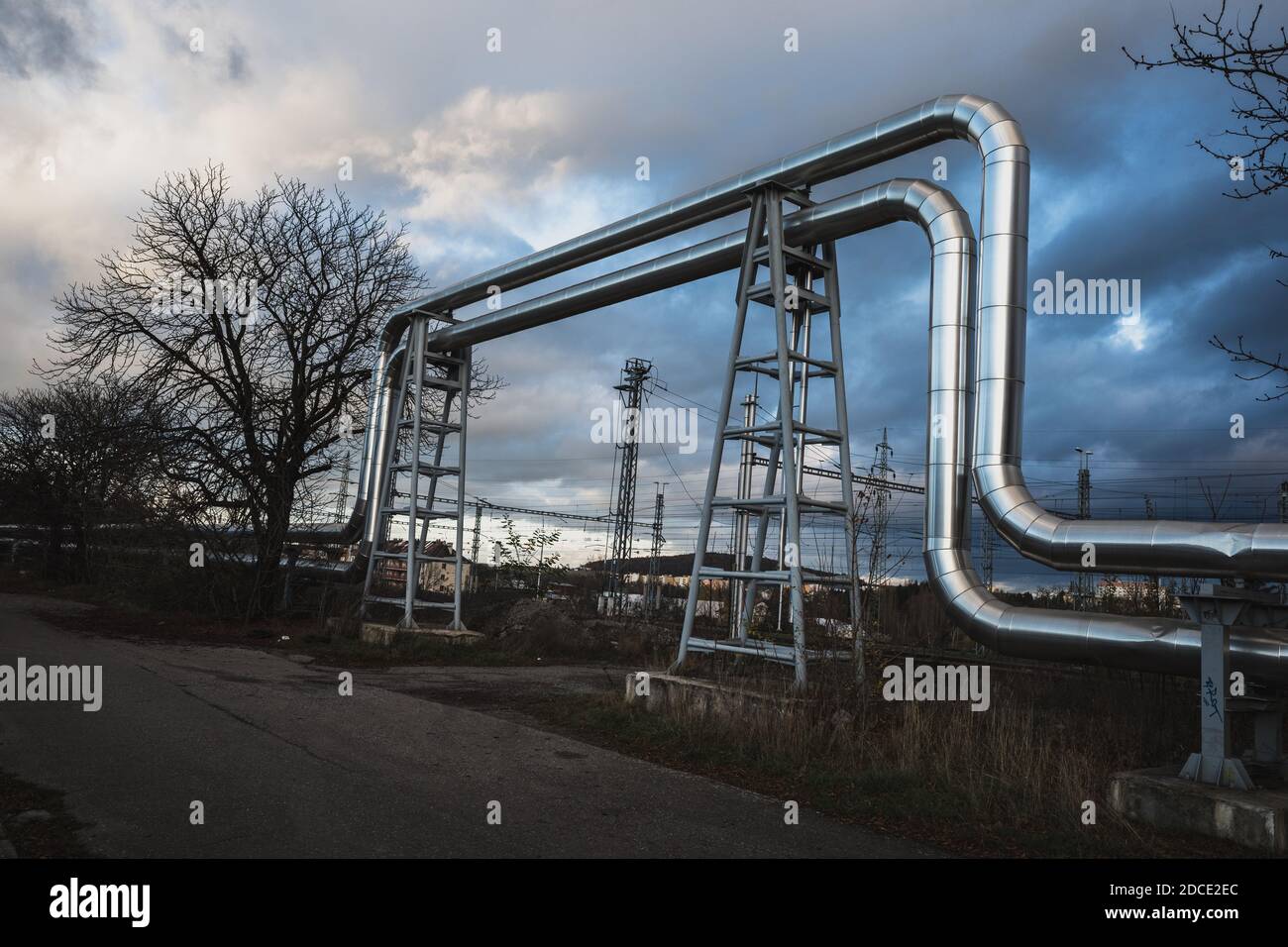 Pipes leading commodities along the railway line Stock Photo - Alamy