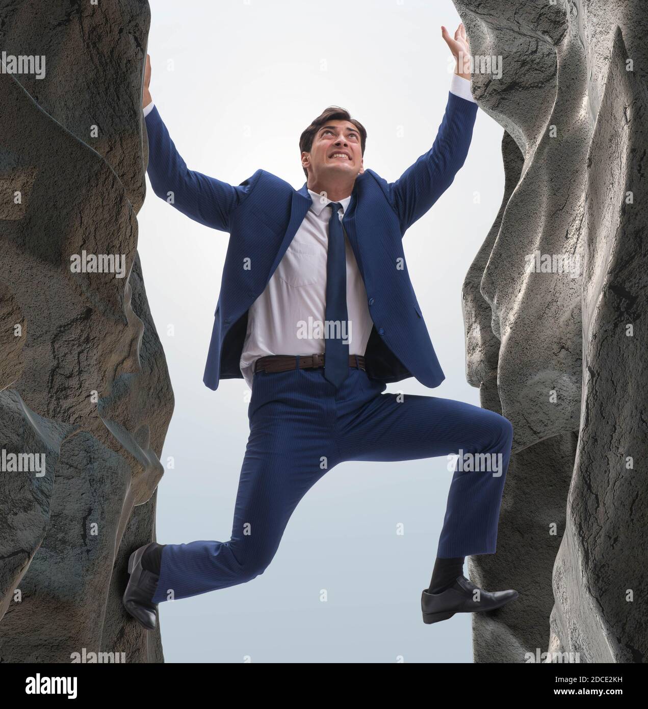 The businessman overcoming challenges in business concept Stock Photo ...