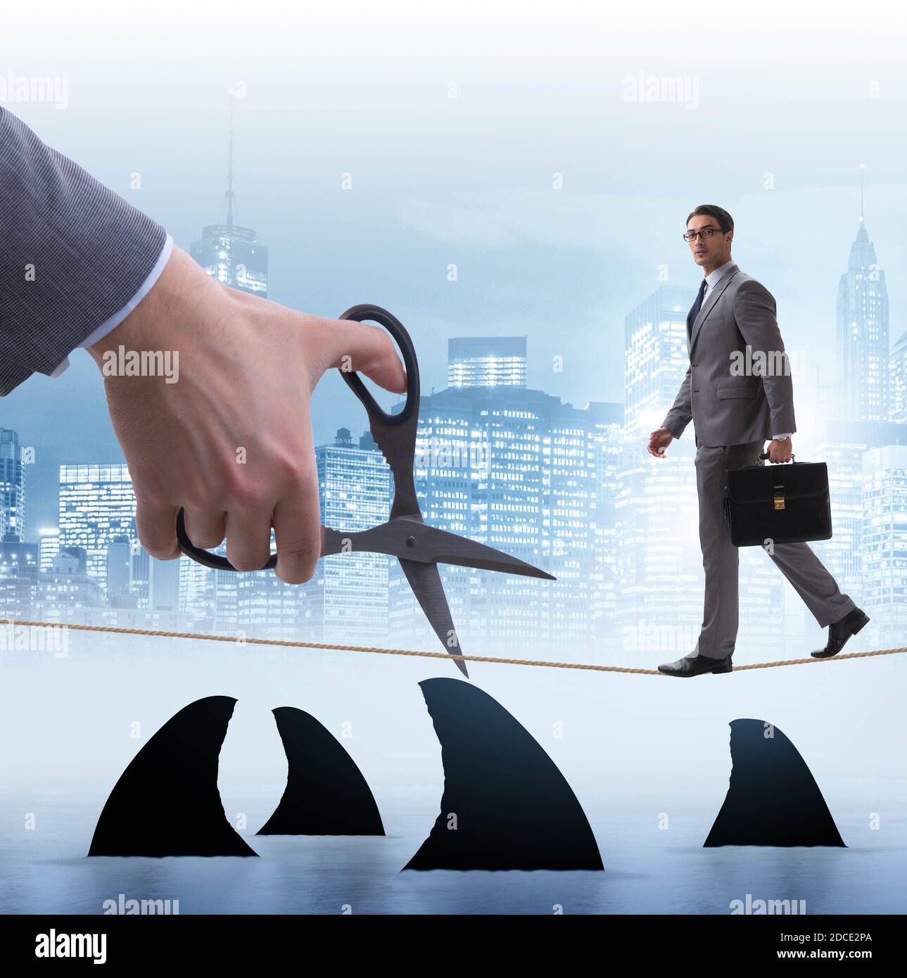 The hand cutting rope in business risk concept Stock Photo - Alamy