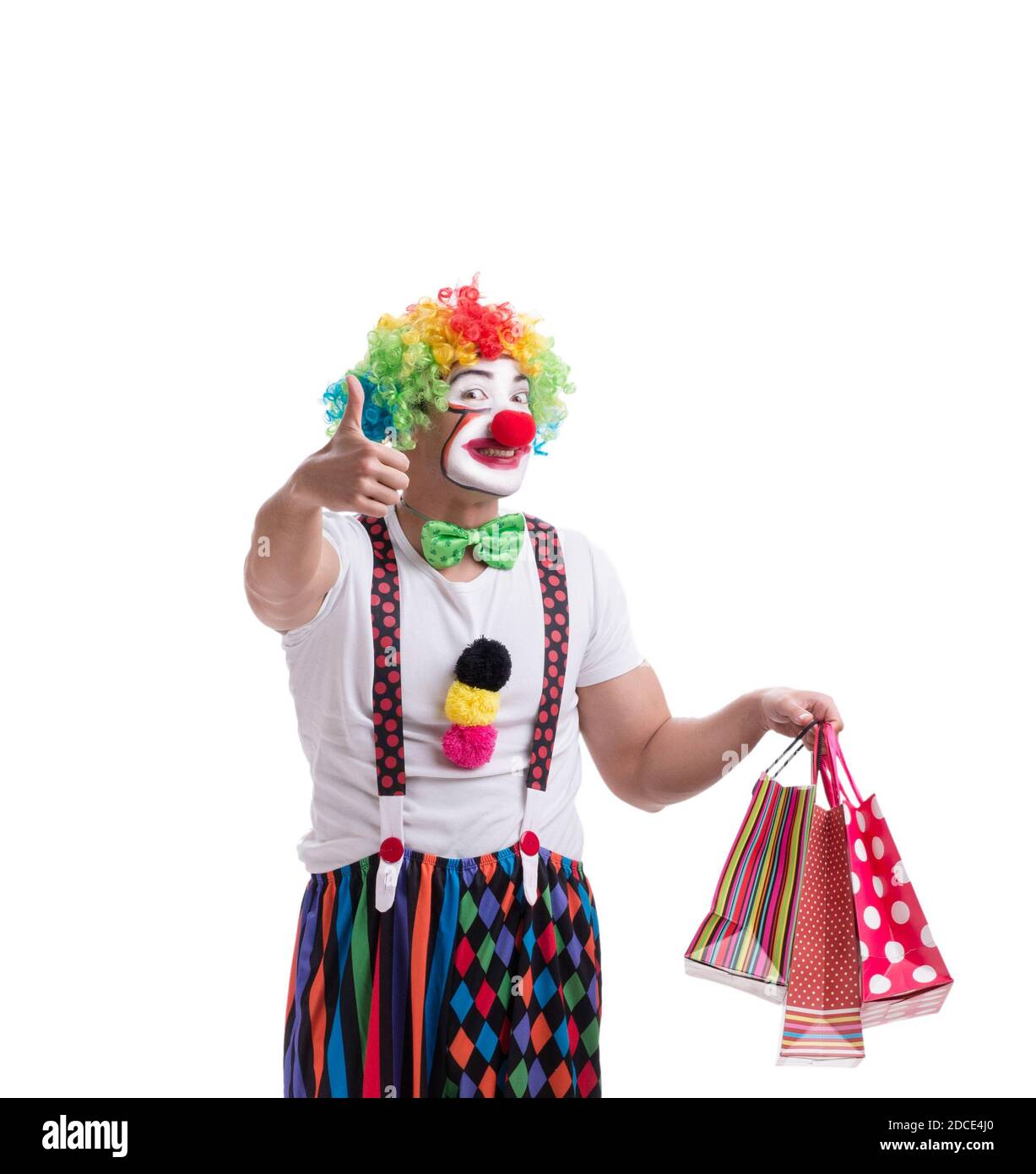 The funny clown with shopping bags isolated on white background Stock ...